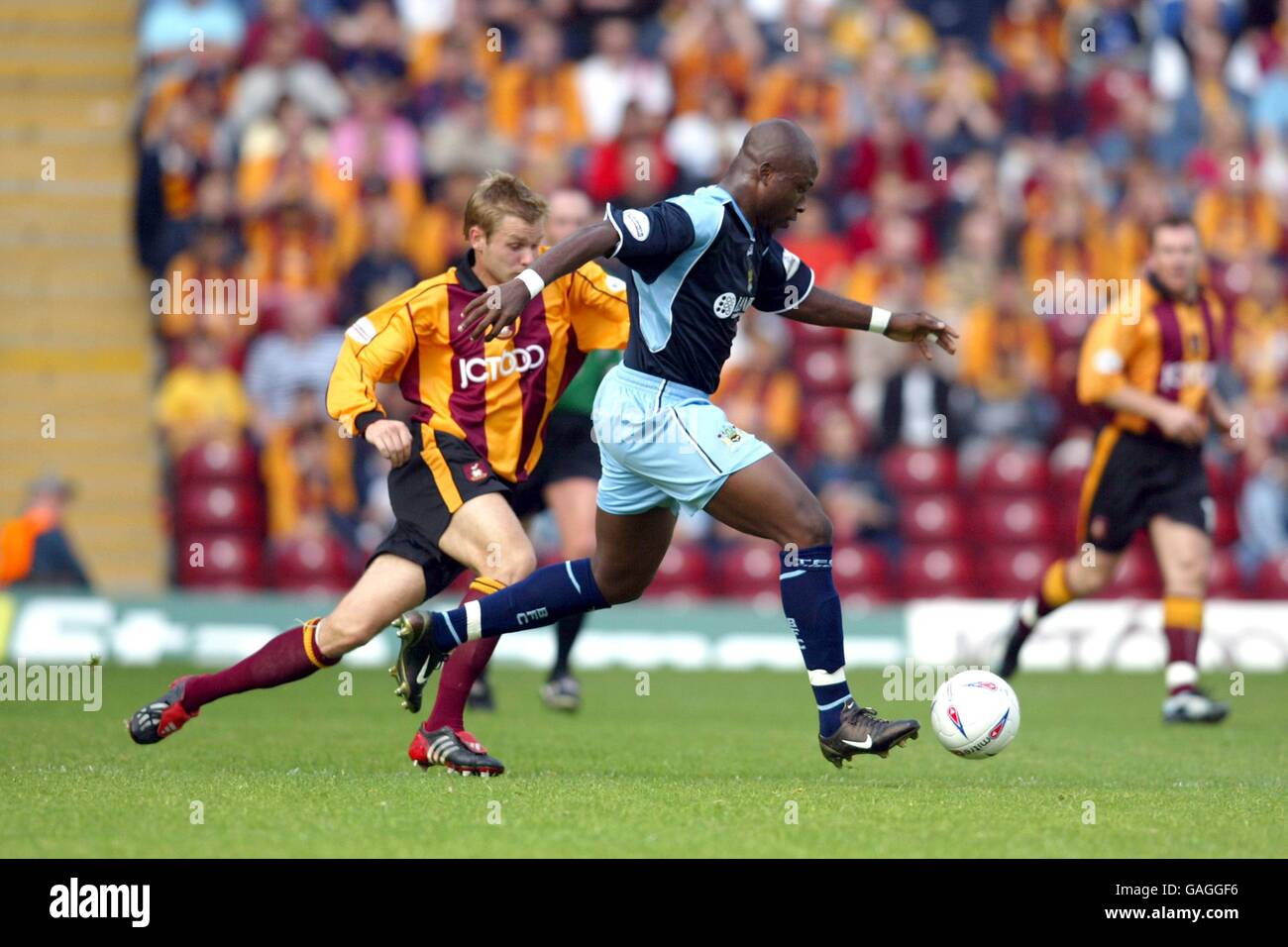 Bradford City's Wayne Proctor (l) and Burnley's Ian Cox (r) battle for ...