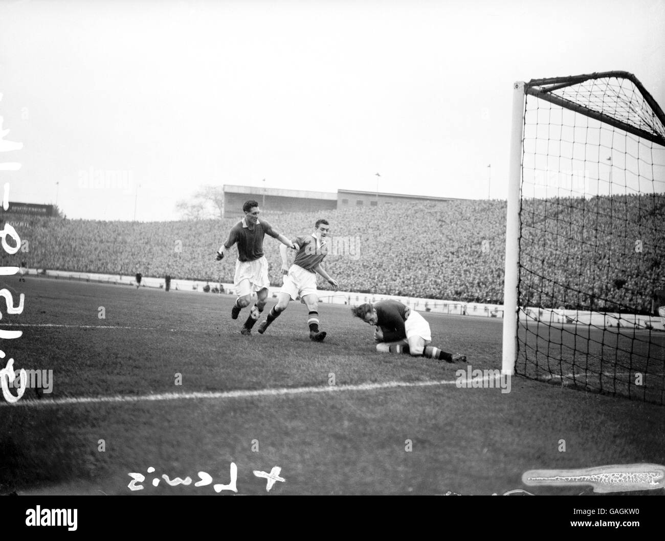 (L-R) Chelsea's Jim Lewis is foiled by Manchester United's Jack Rowley ...