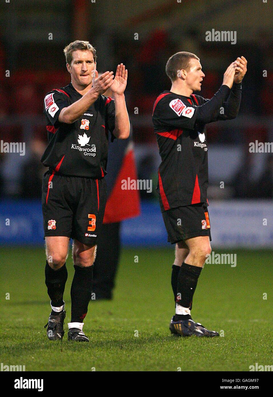 Swindon Town's Jamie Vincent (l) and Jon-Paul McGovern (r) after the ...