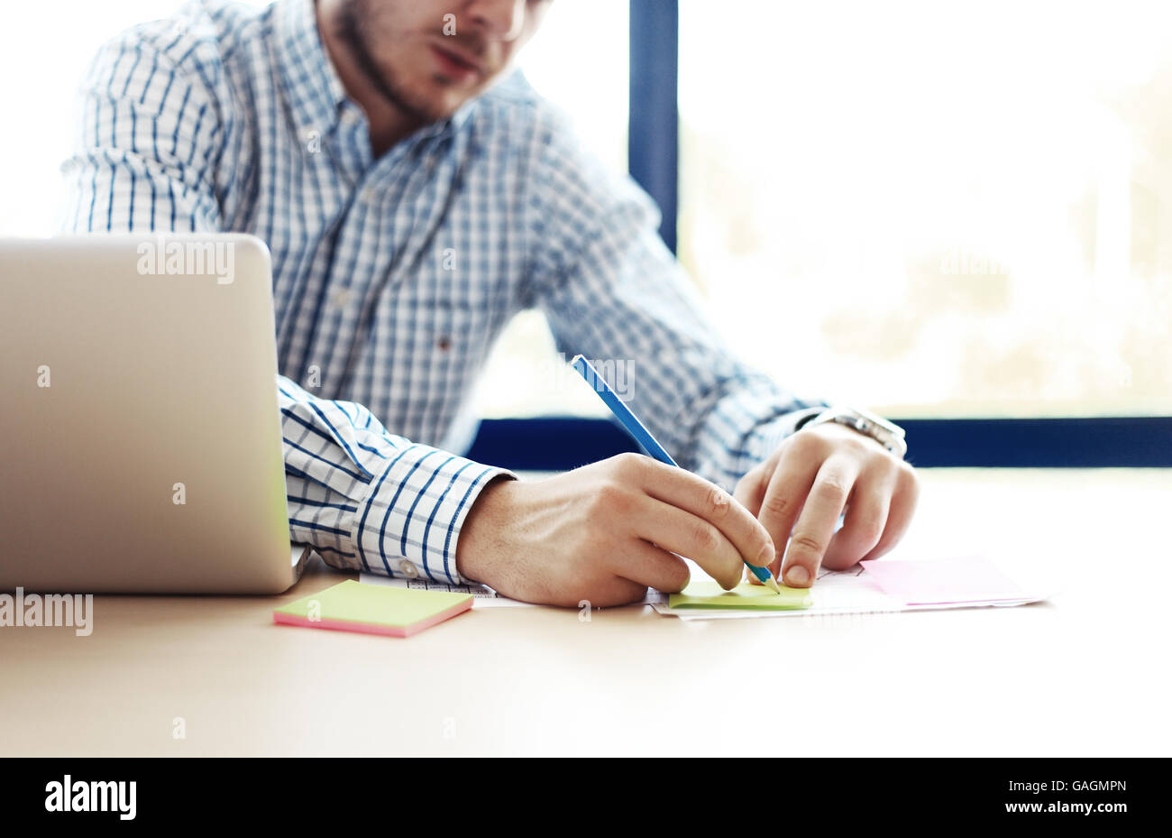 Business man working at office with laptop and documents on his desk ...