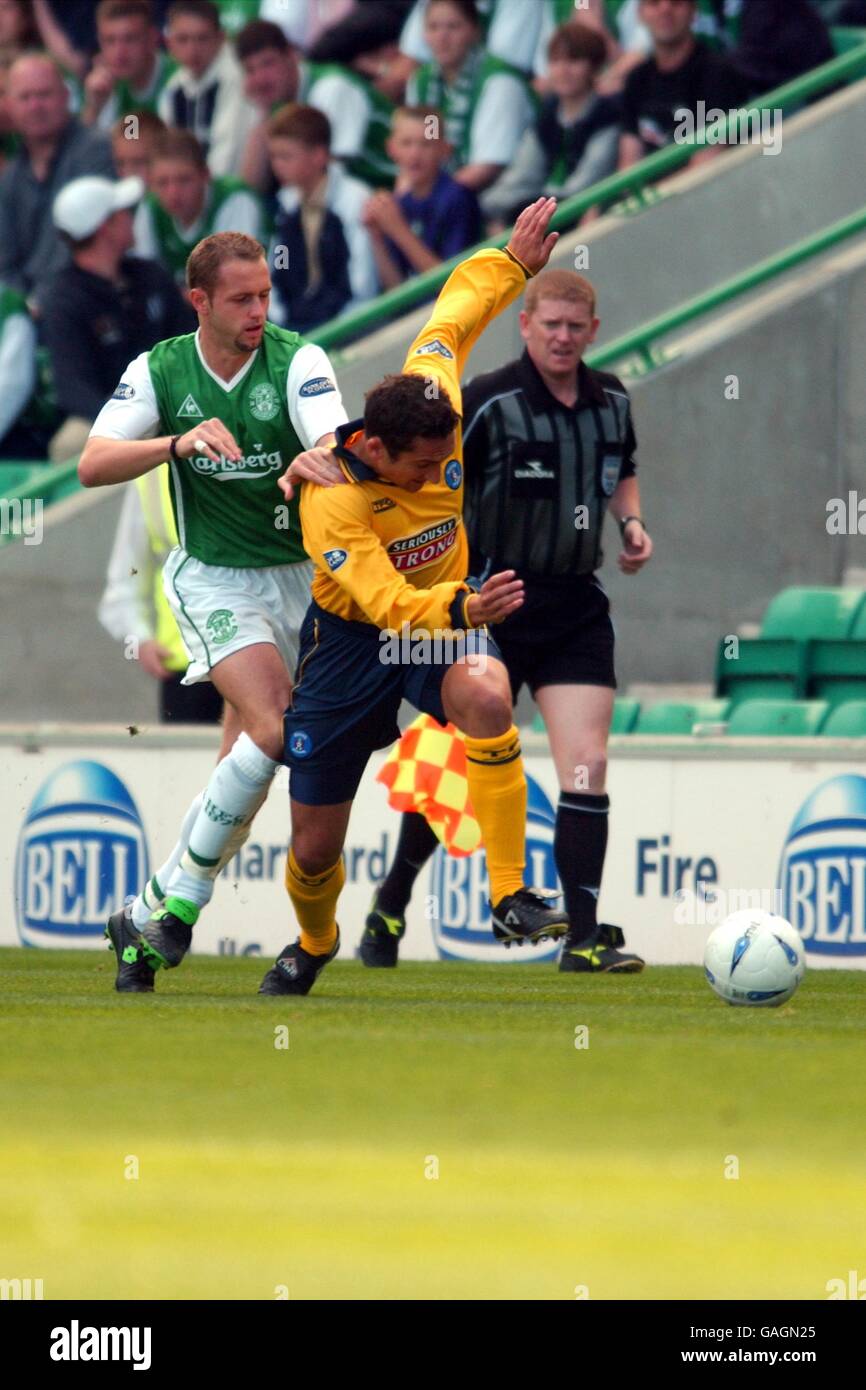 L-R; Hibernian's Grant Brebner holds back Kilmarnock's Peter Canero ...