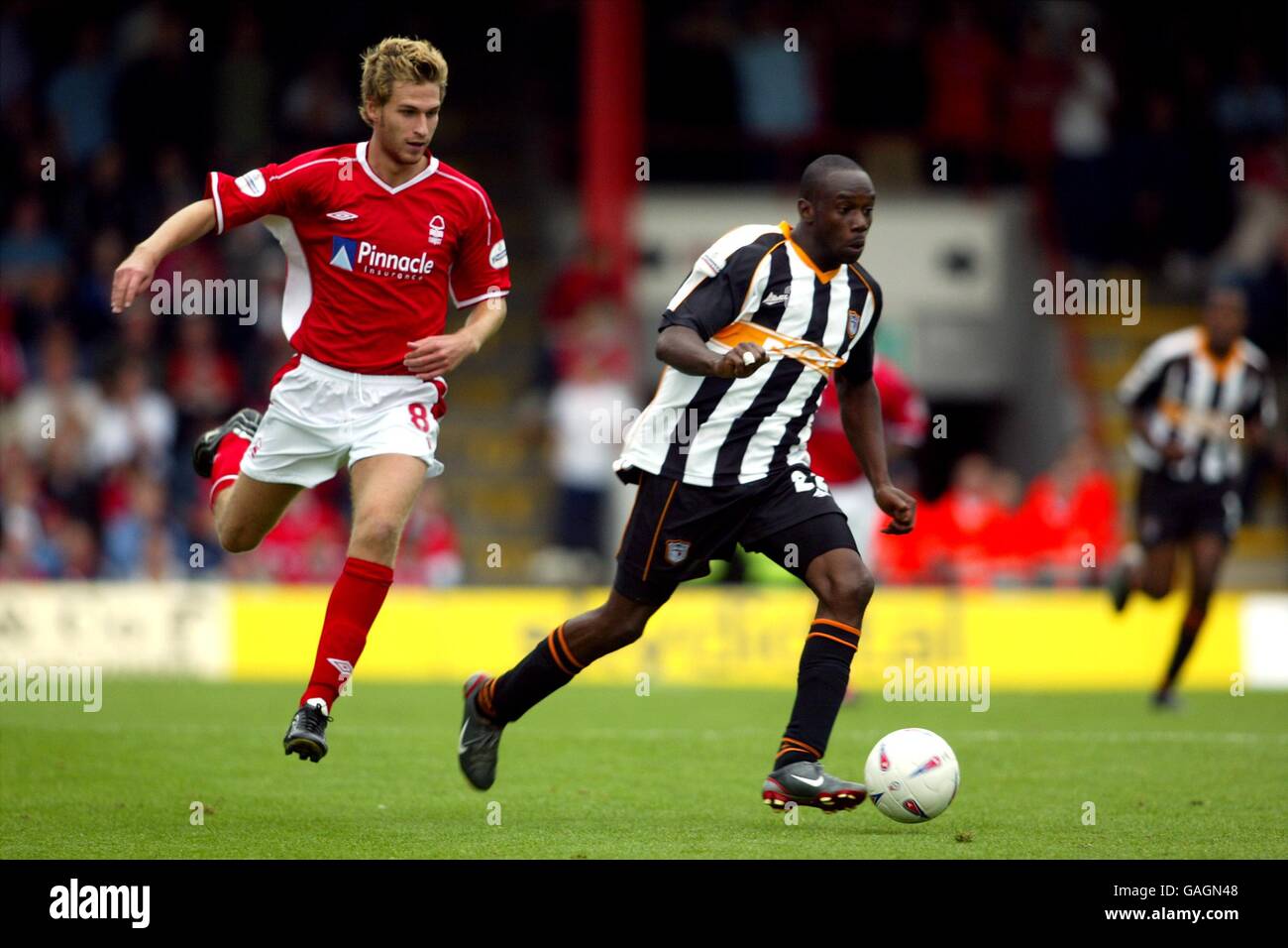 Grimsby Town's Steve Kabba beats Nottingham Forest's Gareth Williams to ...