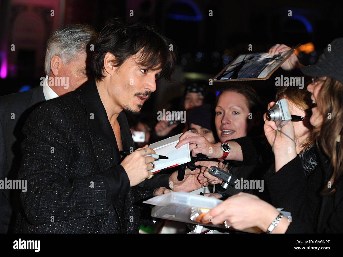 Johnny Depp arrives for the premiere of Sweeney Todd: The Demon Barber ...