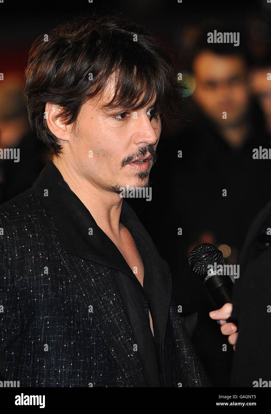 Johnny Depp arrives for the premiere of Sweeney Todd: The Demon Barber ...