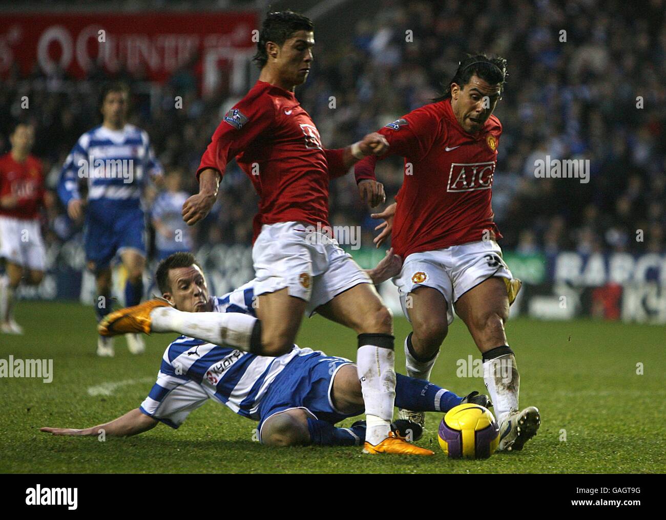 Manchester United's Carlos Tevez (r) and Cristiano Ronaldo battle for ...