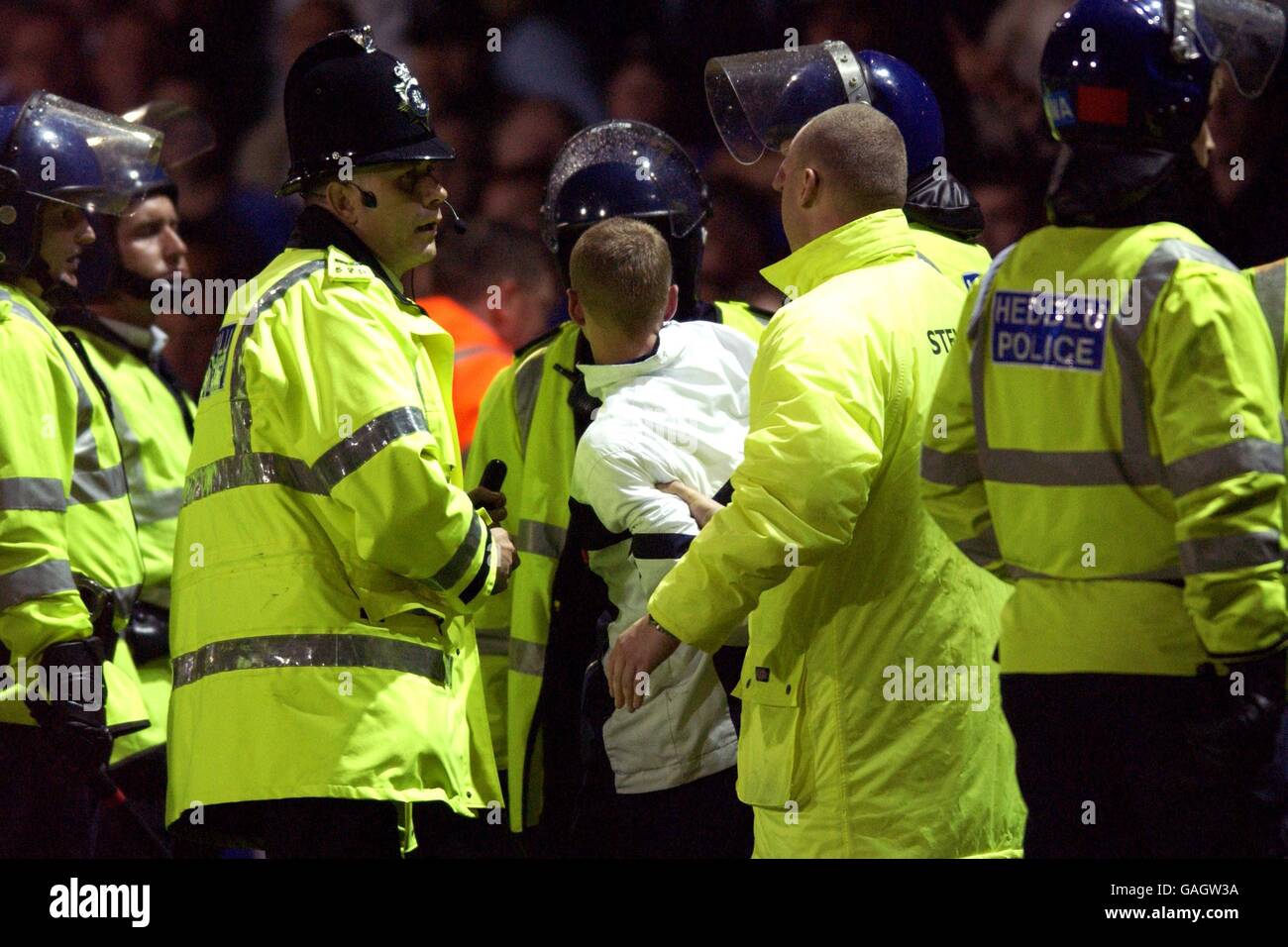 Police arrest Wrexham hooligans storming the pitch in an effort to ...
