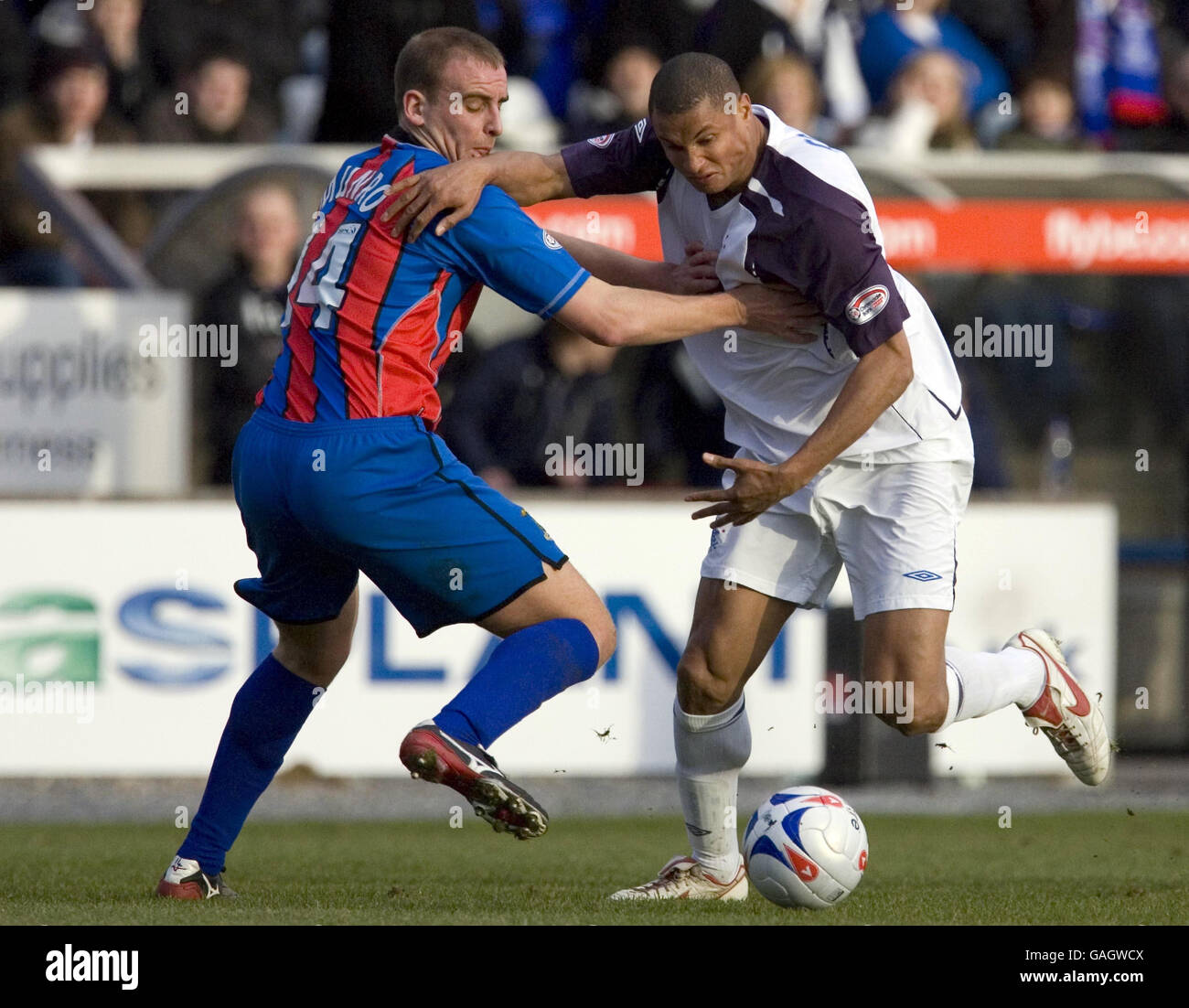 Inverness's Grant Munro looks to tackle Rangers' Daniel Cousin during ...