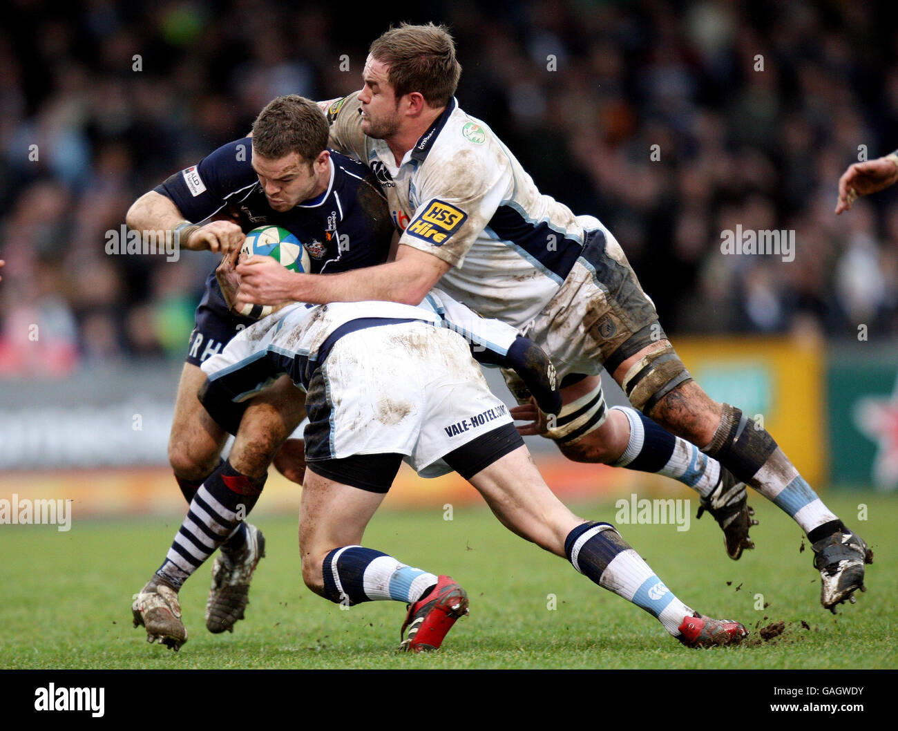 Bristol's Rob Higgitt is tackled by Cardiff's Nick Macleod and Xavier ...