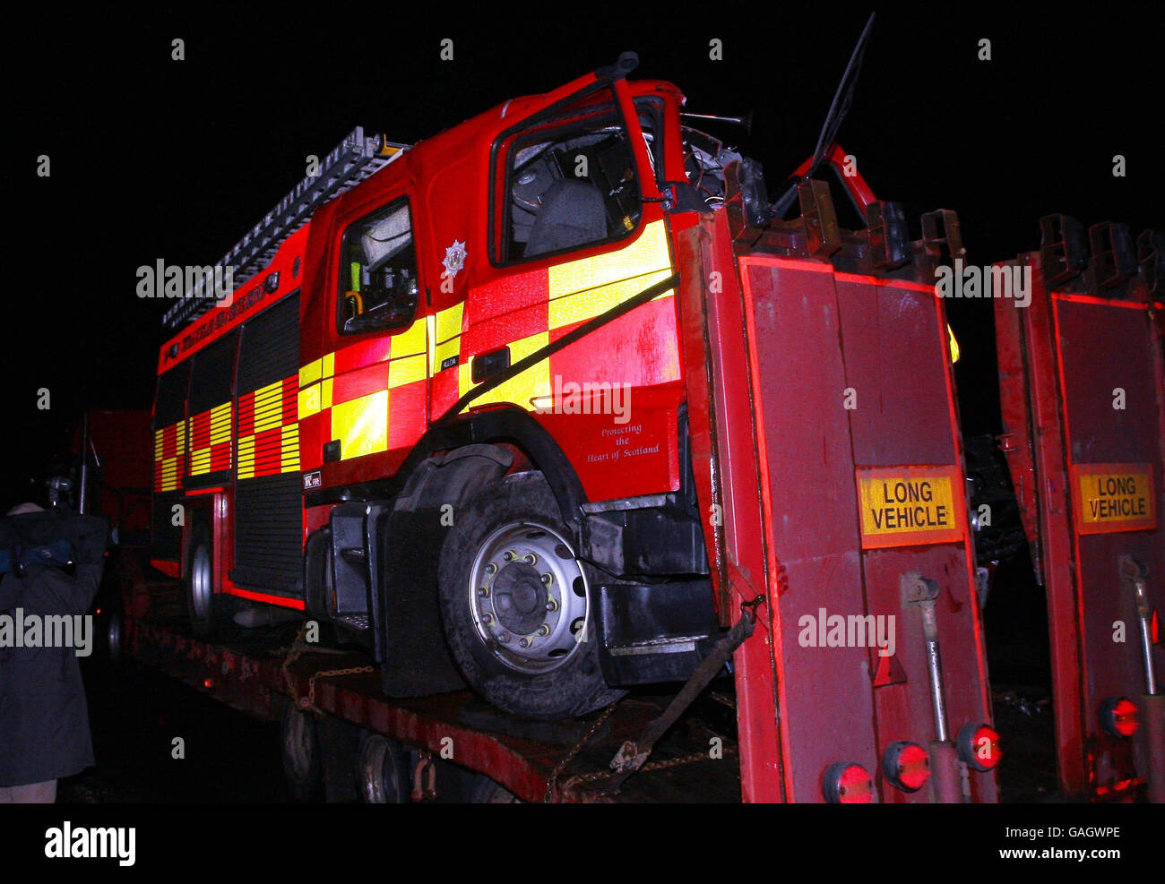 A fire engine is carried away on a low-loader following a crash near ...