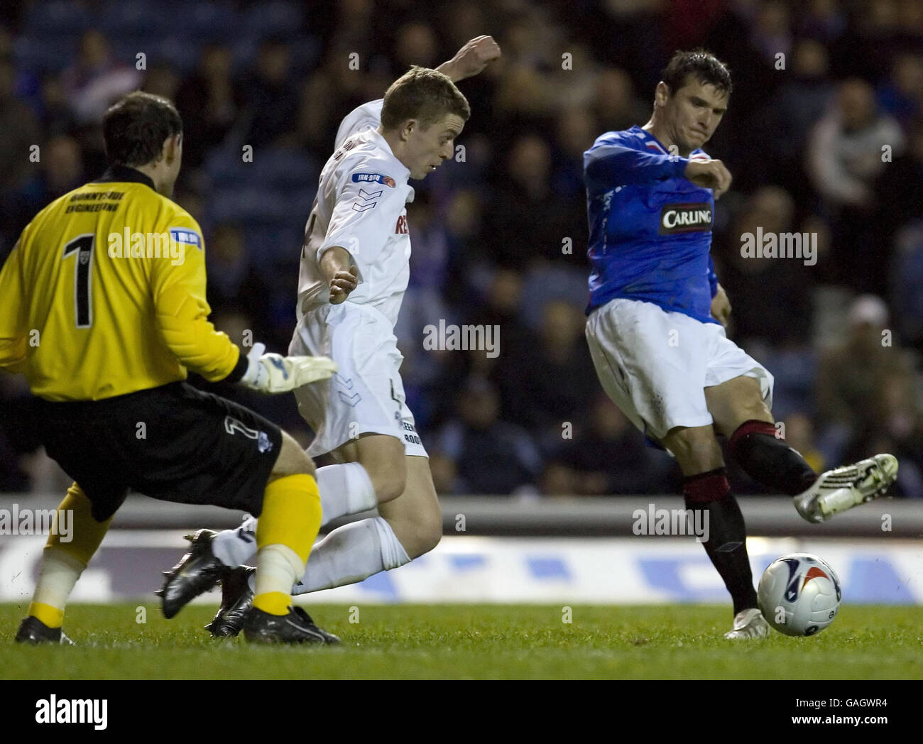 Rangers' Lee McCulloch shoots past East Stirling's Stephen Oates and ...