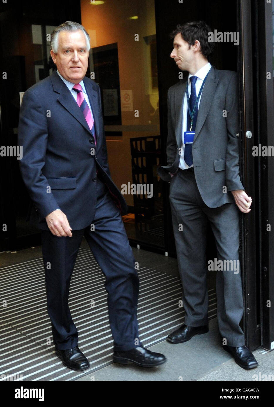 Peter Hain on his way to talk to press outside Caxton House today ...