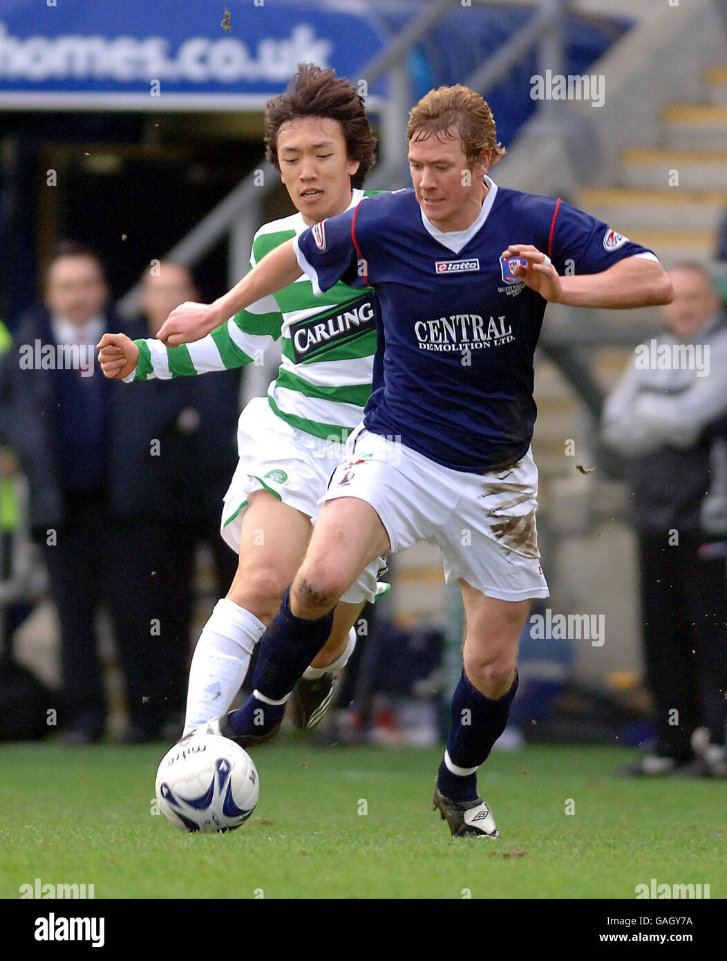 Celtic's Shunsuke Nakamura (left) battles with Falkirk's Dean Holden ...