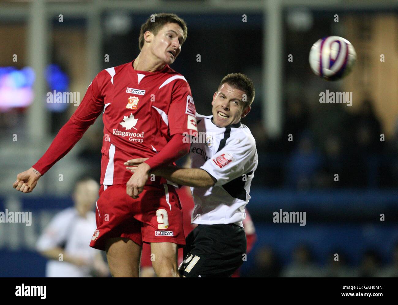Luton's Keith Keane and Swindon's Barry Corr compete for the ball Stock ...