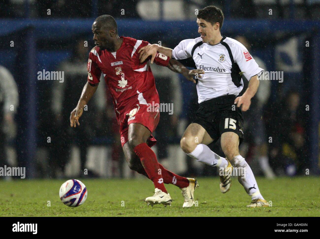 Swindon's Moses Ashikodi and Luton's Stephen O'Leary compete for the ...