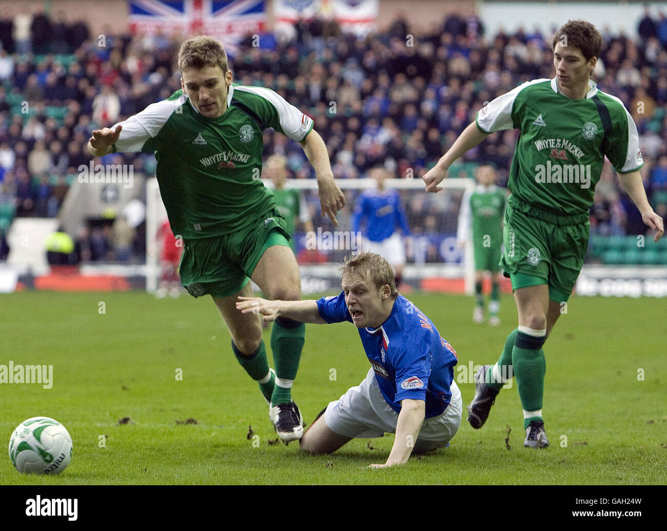 Rangers' Steven Naismith goes to ground after the tackle from Hibernian ...