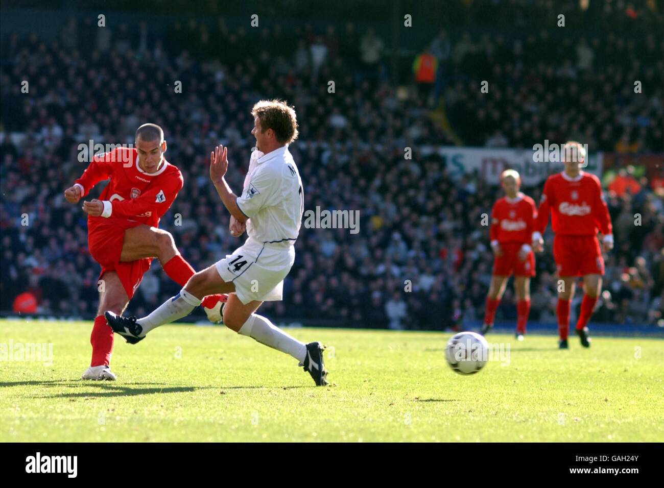 Liverpool's Bruno Cheyrou gets a shot in past Leeds United's Stephen ...