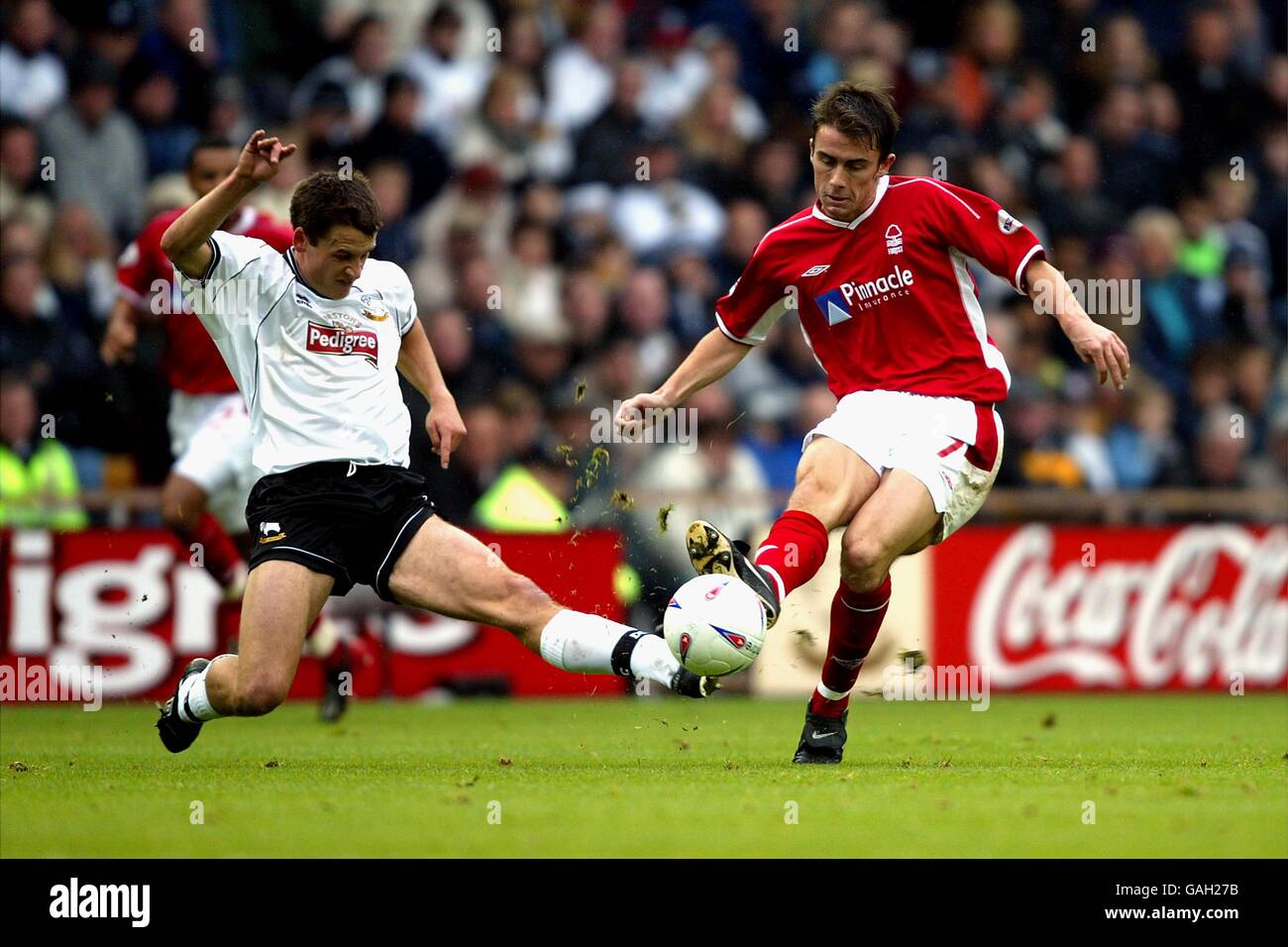 Derby County's Paul Boertien tackles Nottingham Forest's David Prutton ...