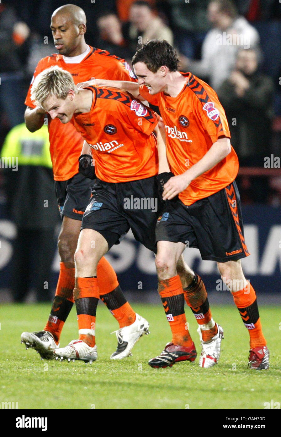 Dundee United's Christian Kalvenes (left) celebrates his goal with team ...