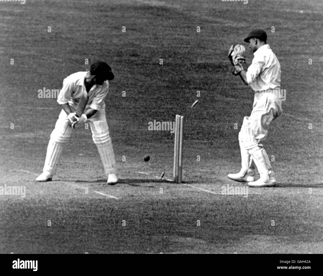 Australia's Len Darling (l) is clean bowled by England's Hedley Verity ...