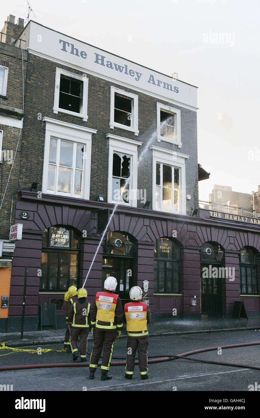 Firefighters continue to damp down after a large fire ripped through ...