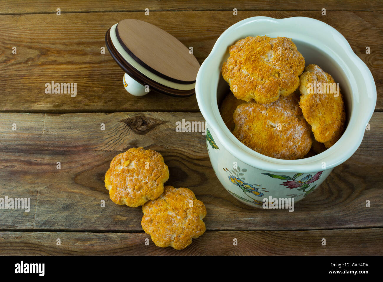 Cookies in a porcelain jar on rustic wooden background. Breakfast ...