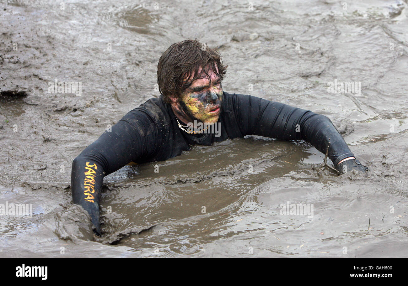 Competitors fall into large swamp like pools as they try to get over ...