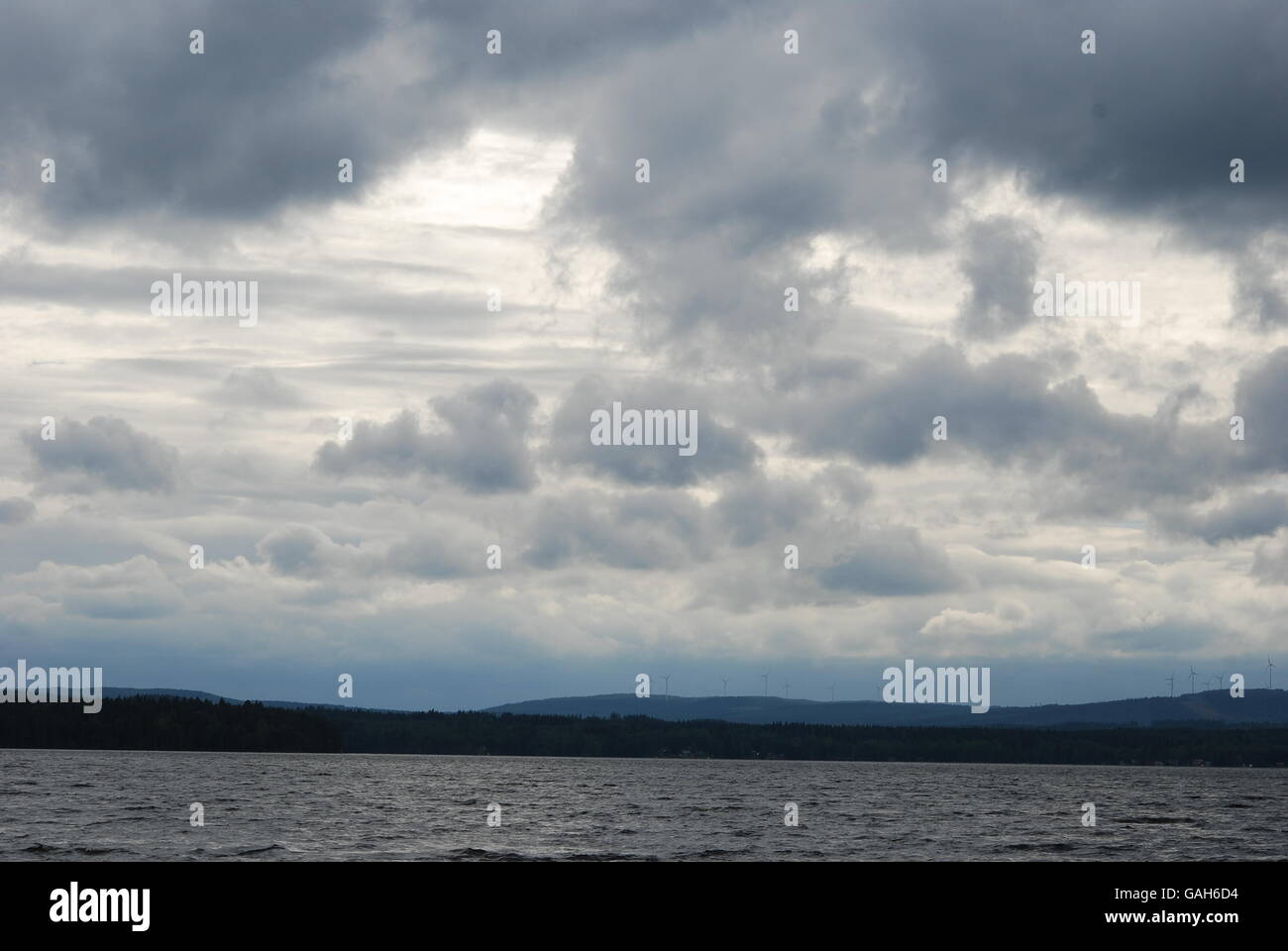 Clouds with rain over lake Stock Photo - Alamy