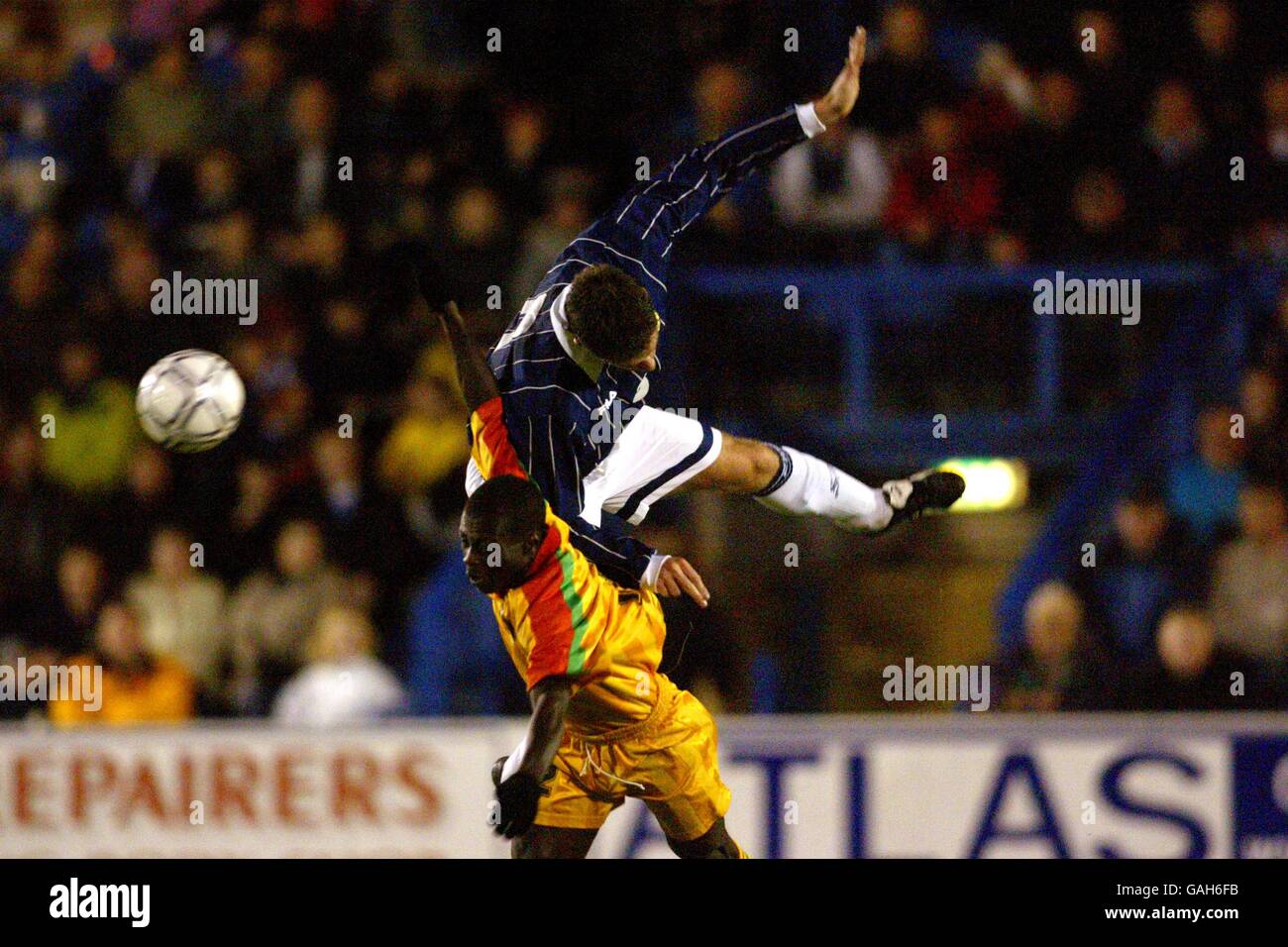 Scotlands chris doig leaps onto ghanas imoro lukman hi-res stock ...