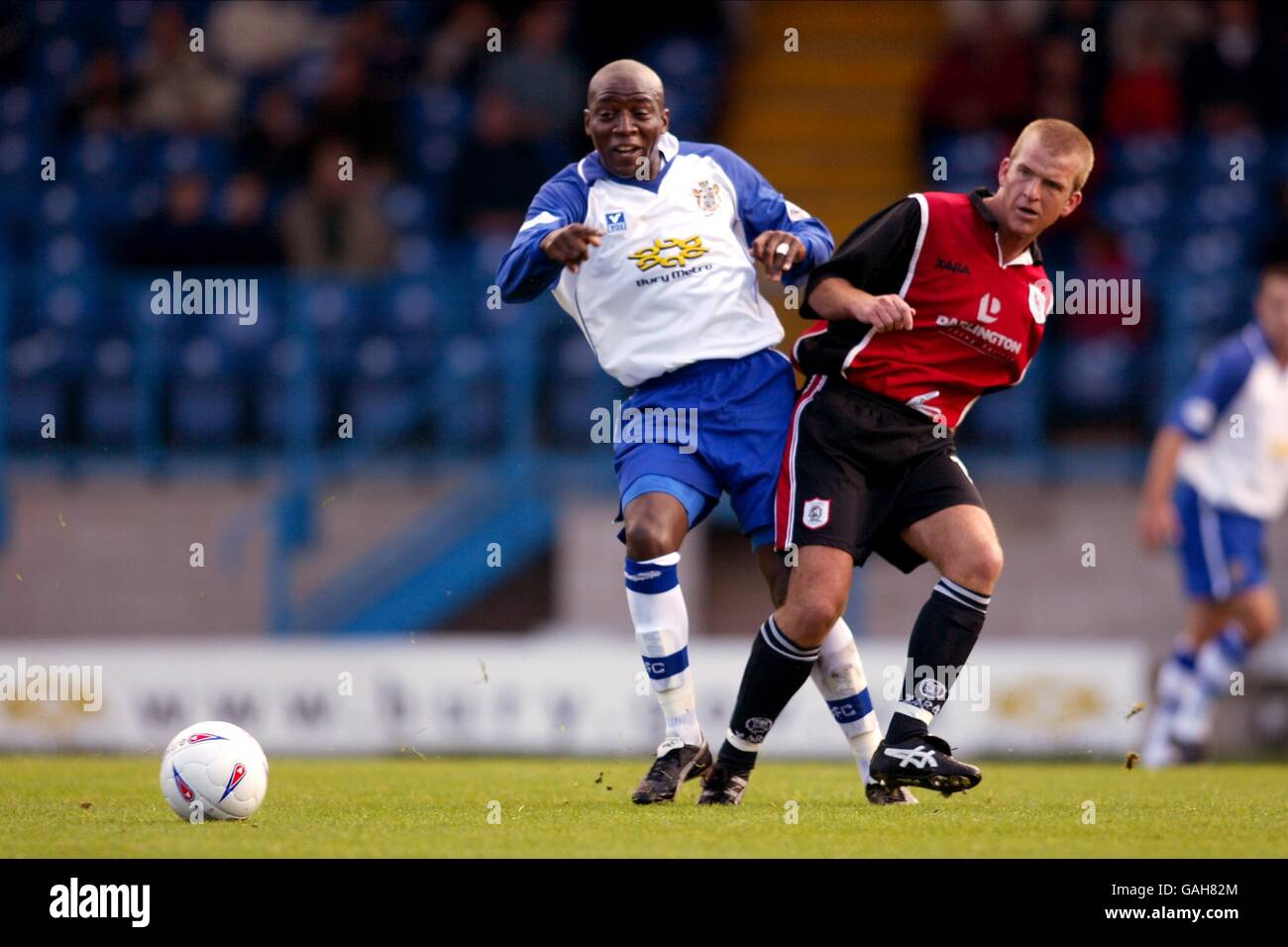 Burys chris billy l closes down darlingtons neil maddison r hi-res ...