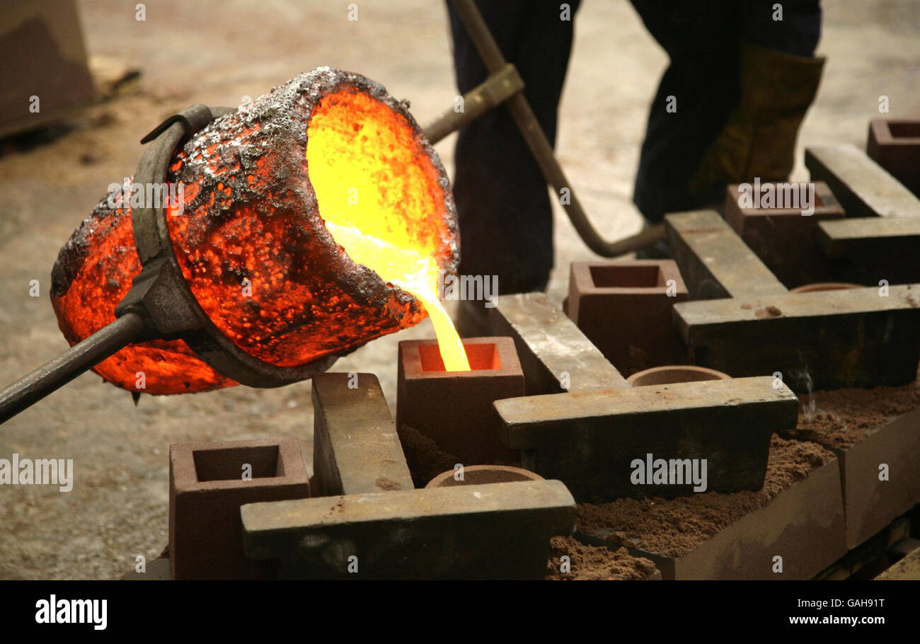 Foundrymen pour phospher bronze into BAFTA mask moulds at New Pro ...