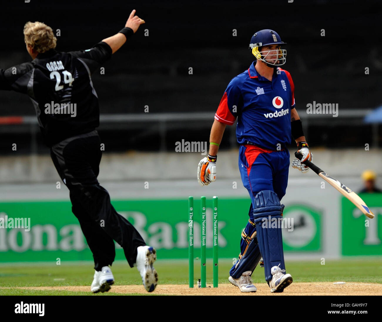 England's Kevin Pietersen is bowled by New Zealand's Jacob Oram during ...
