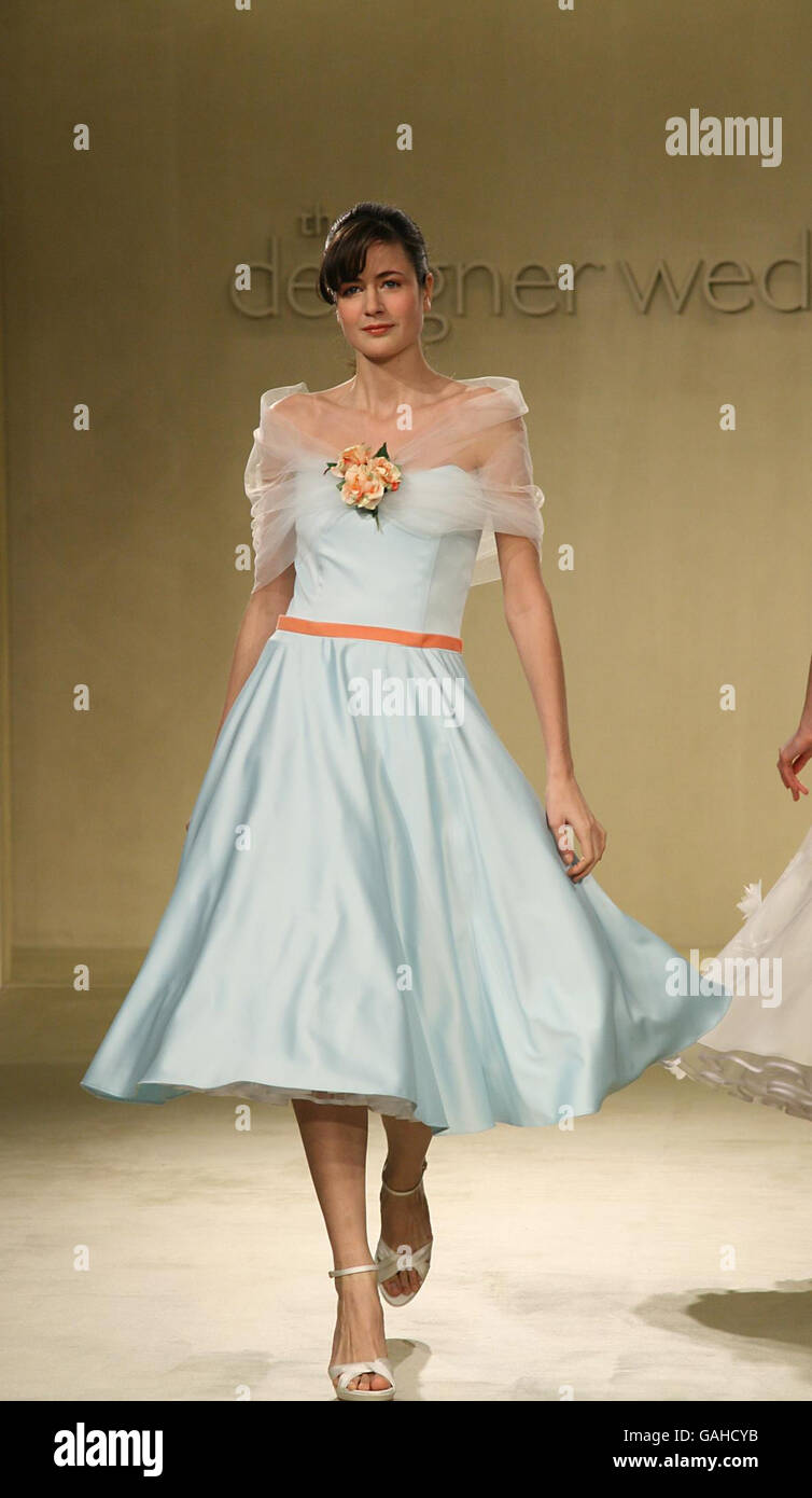 A model wearing a Candy Anthony wedding dress on the runway at the ...
