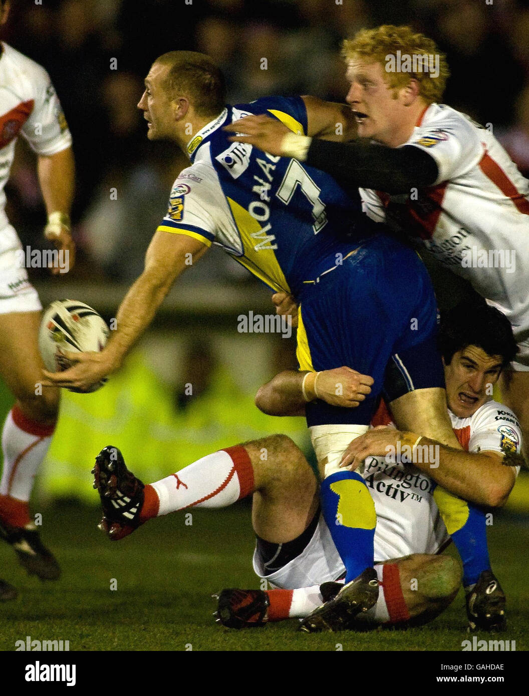 Warrington's Michael Monaghan offloads under pressure from St Helen's ...