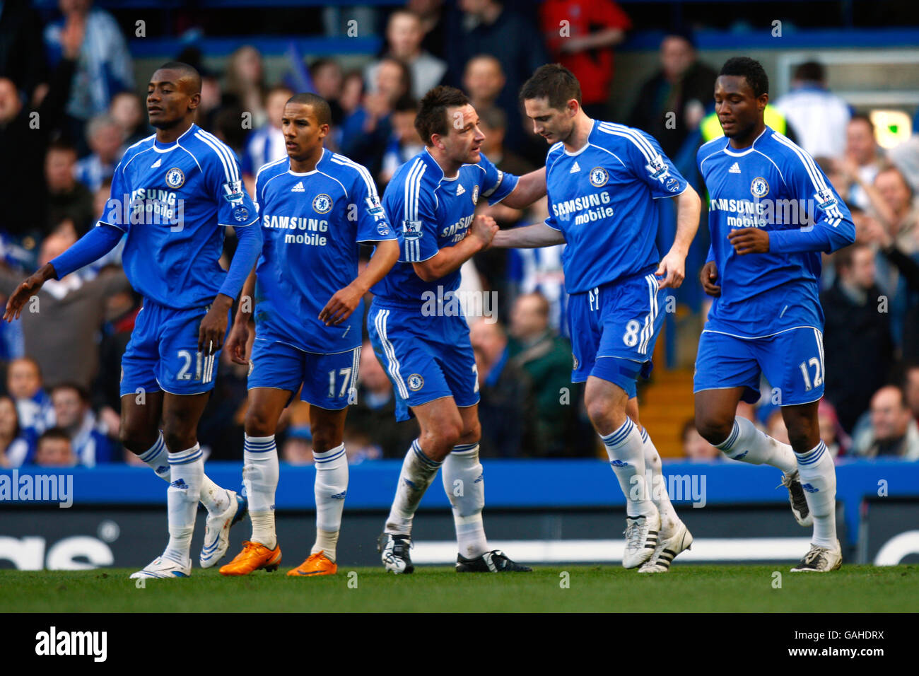 Chelsea's returning captain John Terry (3rd from left) congratulates ...