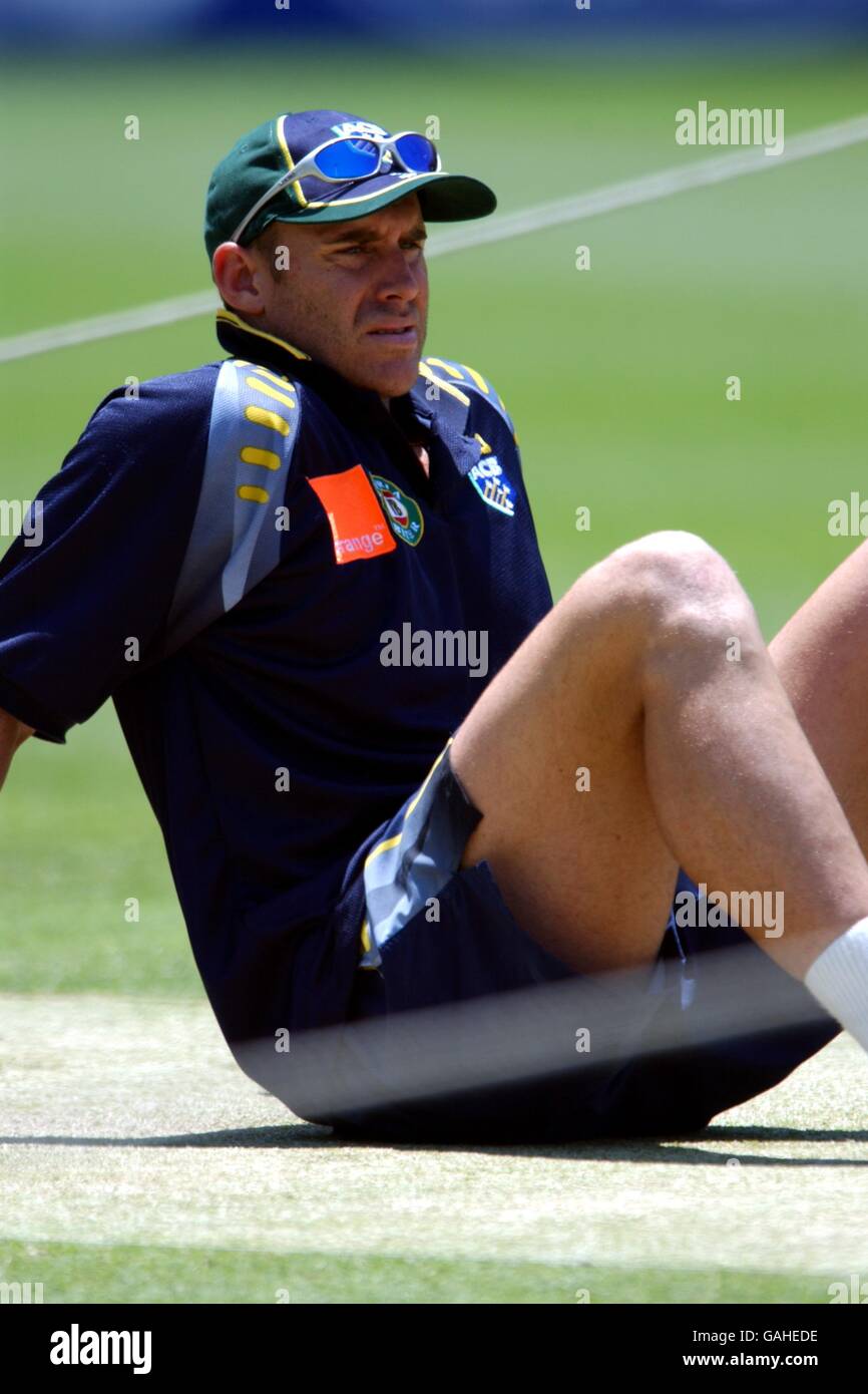 Australia's Matthew Hayden sits on the pitch at the GABBA during an ...