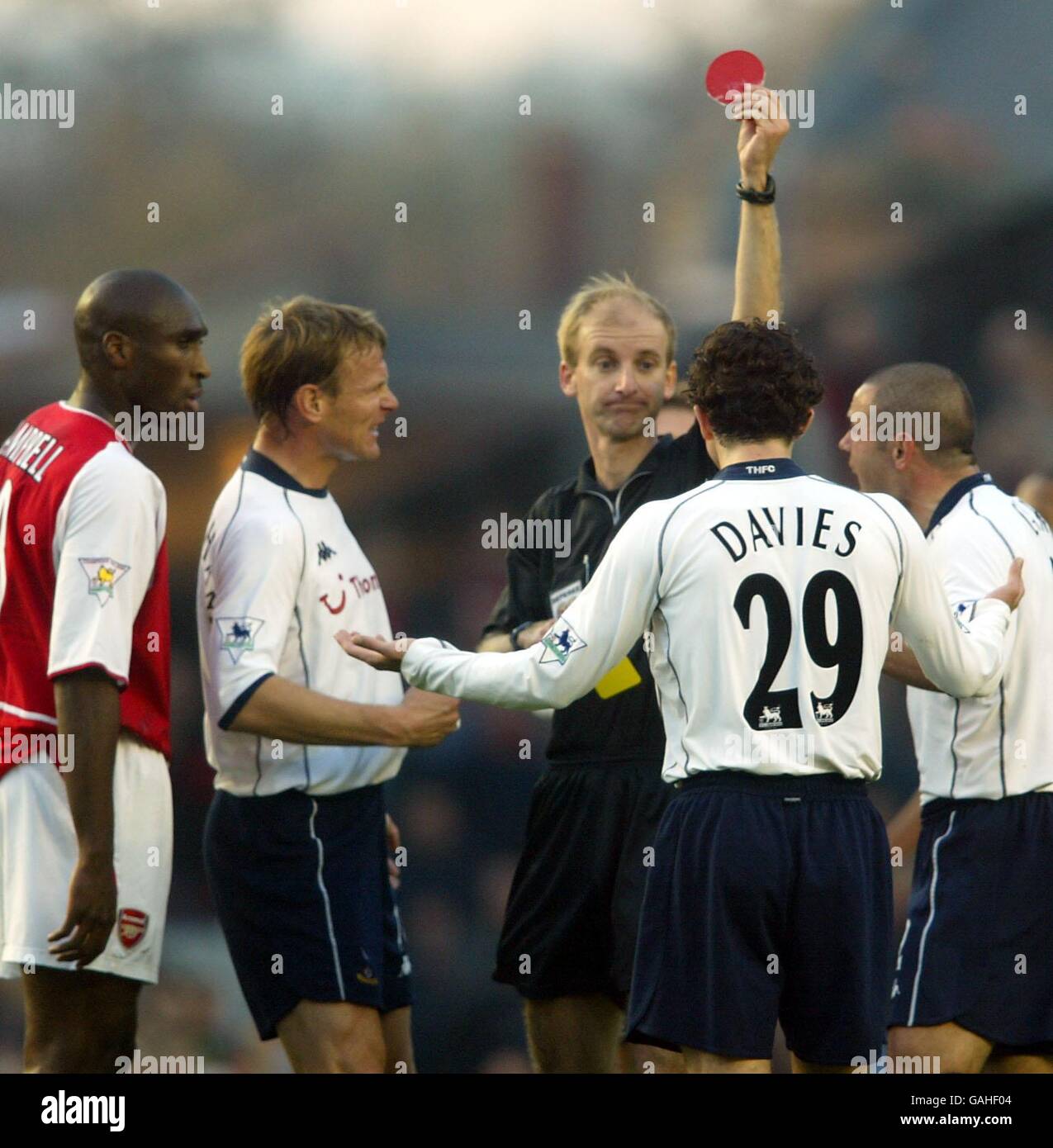 Referee Mike Riley sends off Tottenham Hotspur's Simon Davies against ...