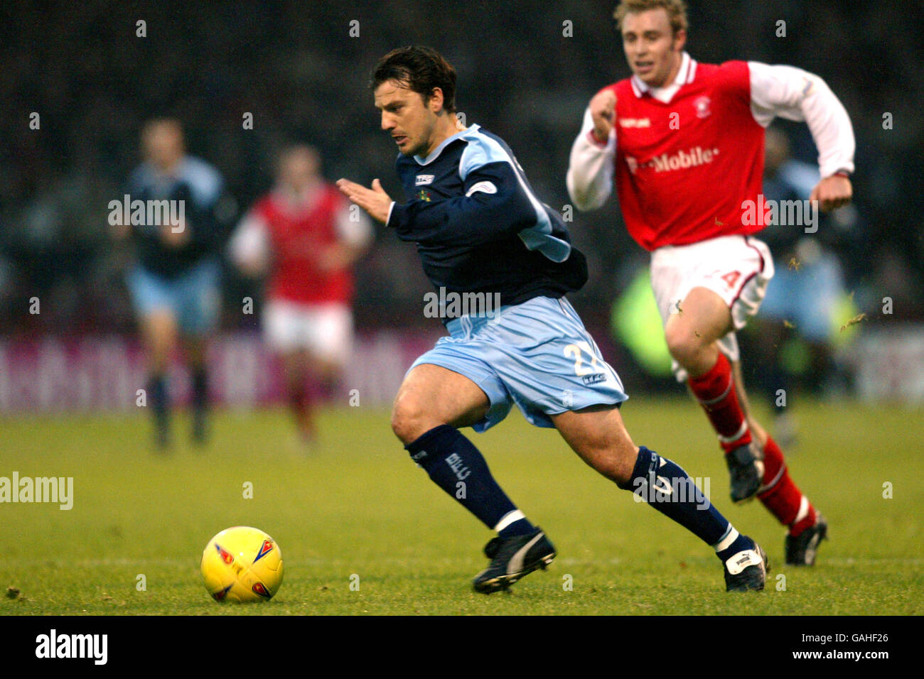 Rotherham United's Rob Scott is left trailing by the pace of Burnley's ...