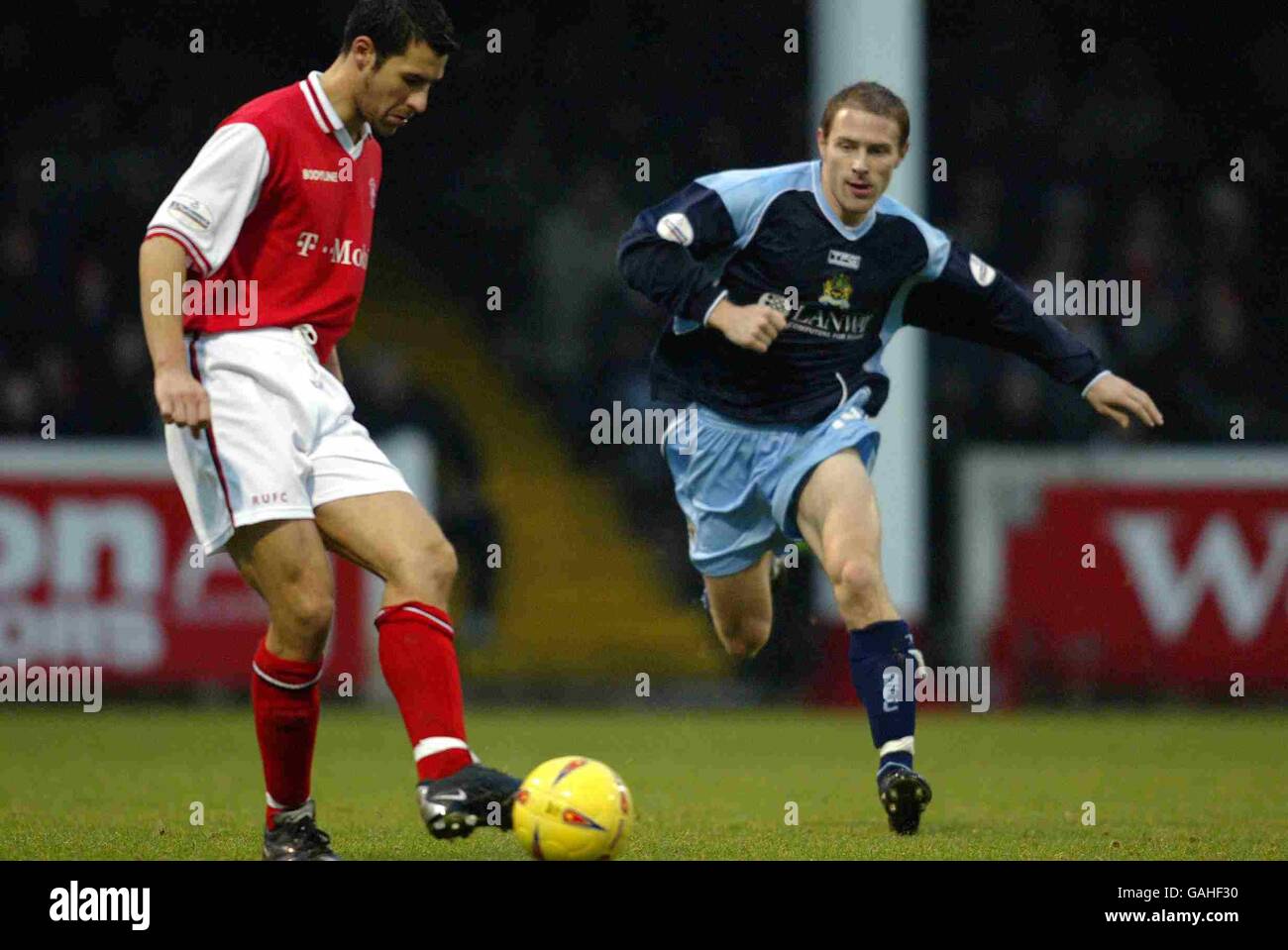 Rotherham United's captain Martin McIntosh attempts to clear the ball ...