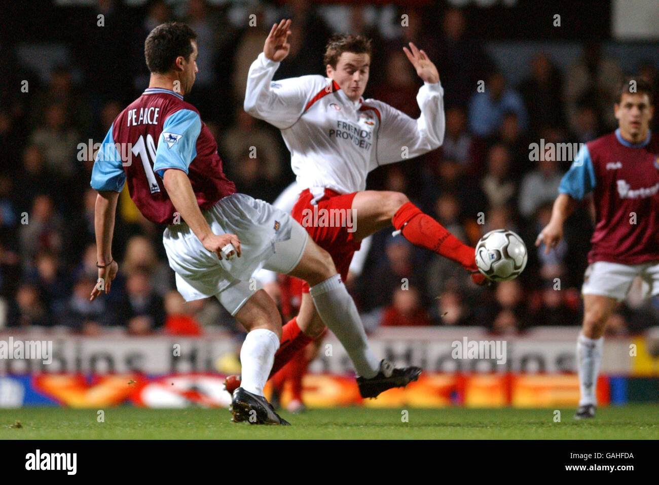 West Ham United's Ian Pearce challenges Southampton's Wayne Bridge ...