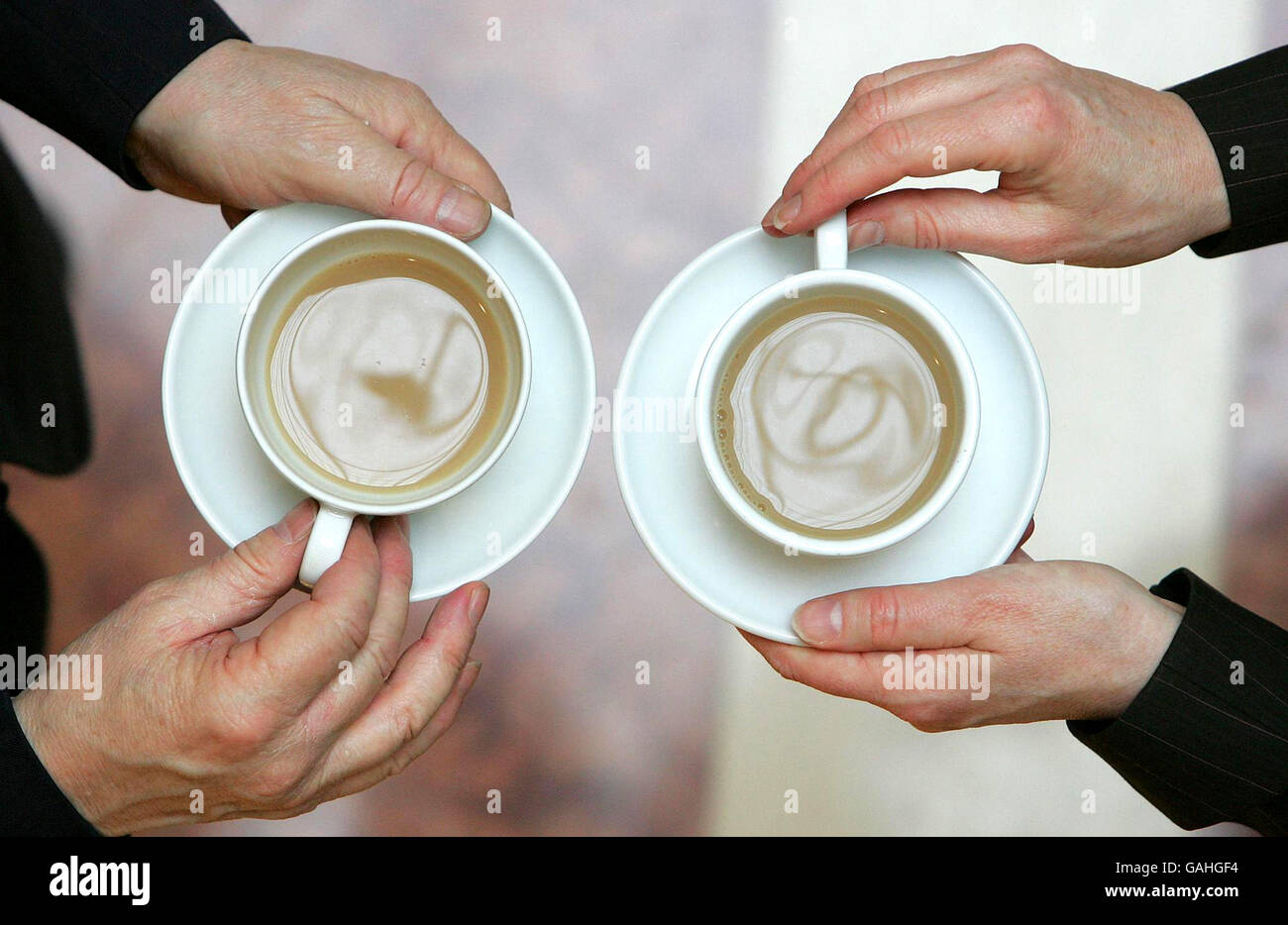 Alun Michael MP (l) and Angela E Smith MP drink a cup of fair trade tea ...