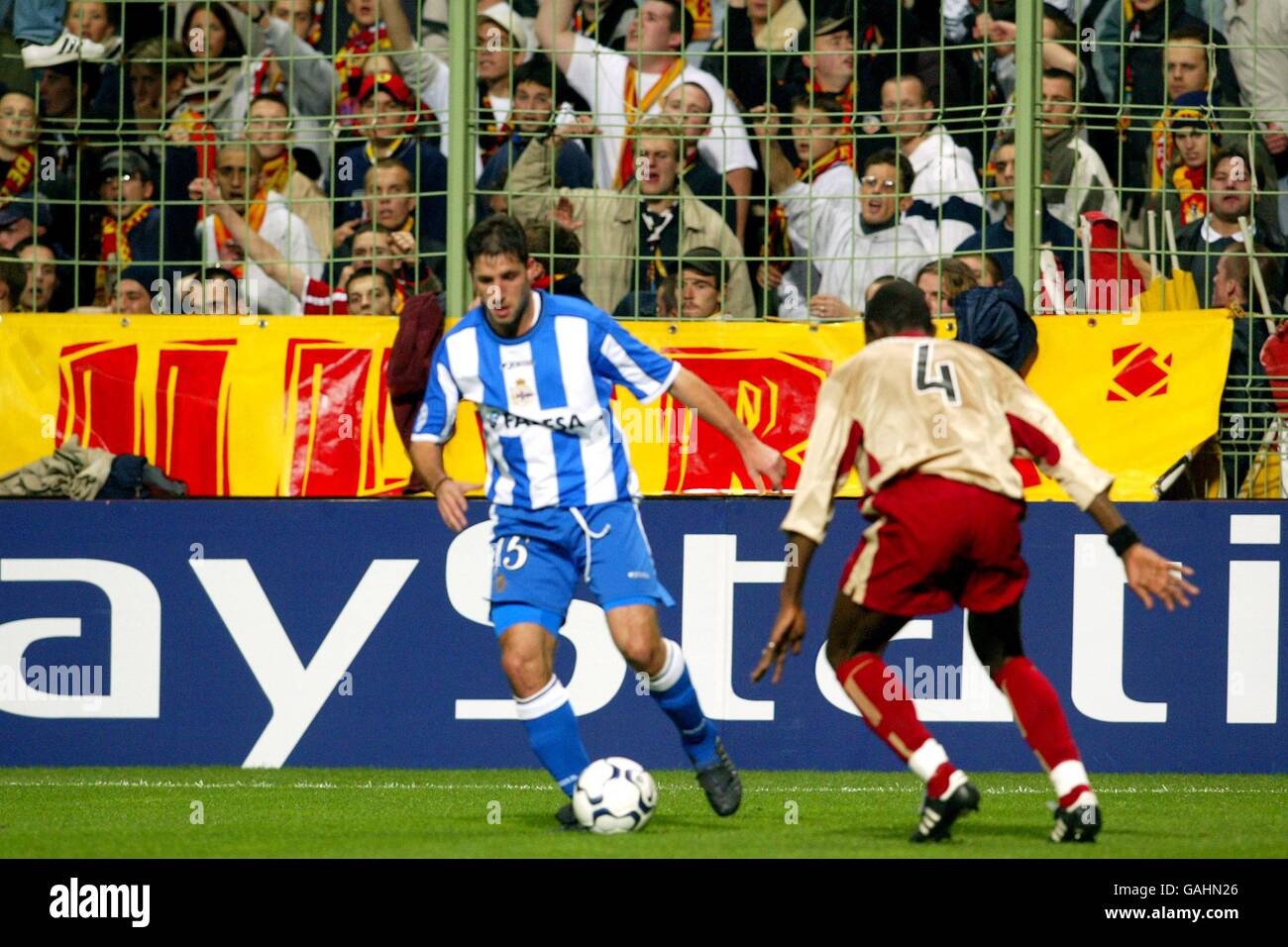 Deportivo La Coruna's Joan Capdevila (l) takes on RC Lens' Adama ...
