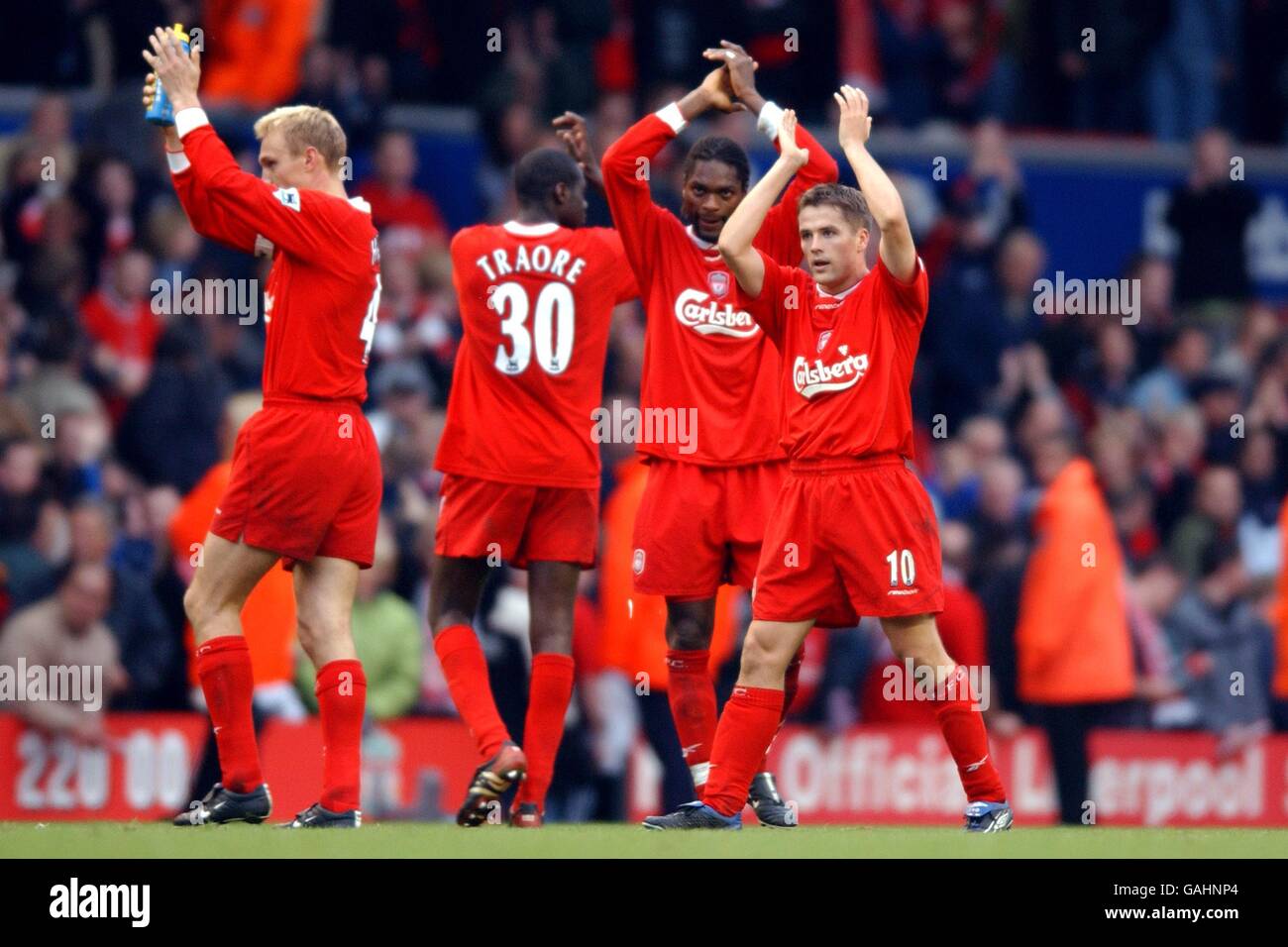 Liverpool players applaud the fans at Anfield after defeating Tottenham ...