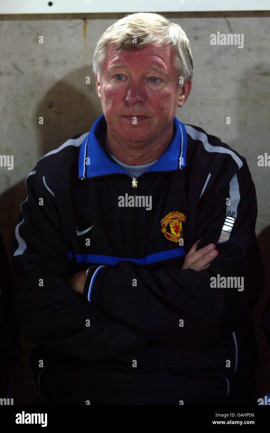 Manchester United's manager Alex Ferguson watches from the bench Stock ...