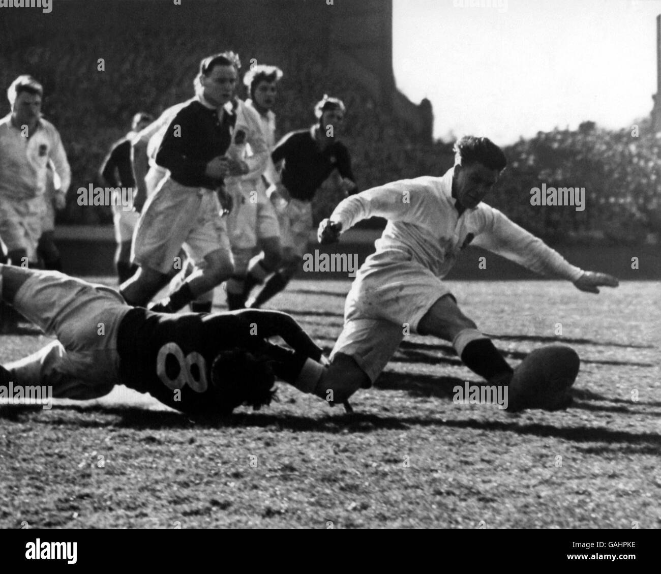 (L-R) Scotland's William Young grabs England's Jimmy Giles by the leg ...
