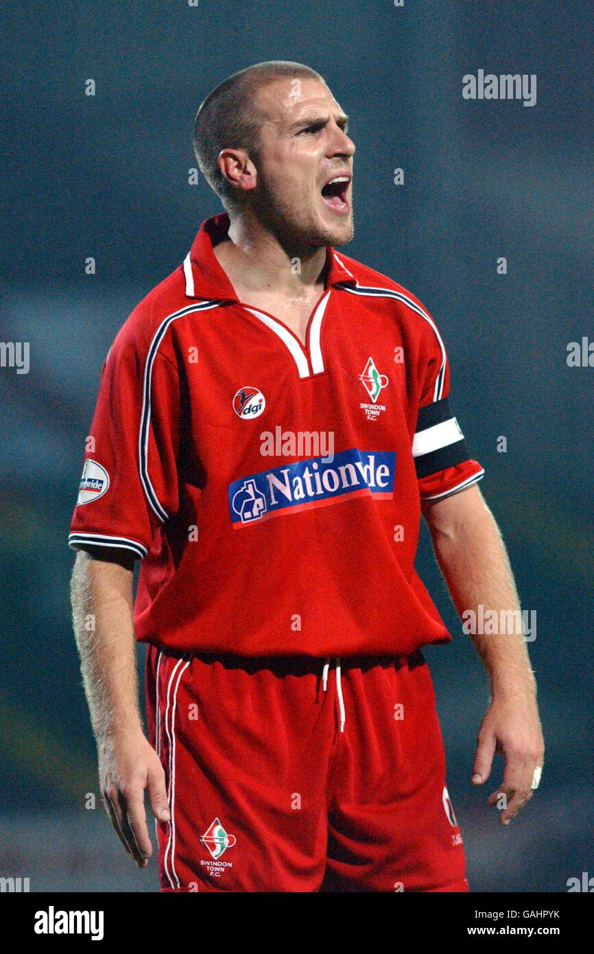 Swindon Town's captain Andy Gurney shouts to his teammates Stock Photo ...