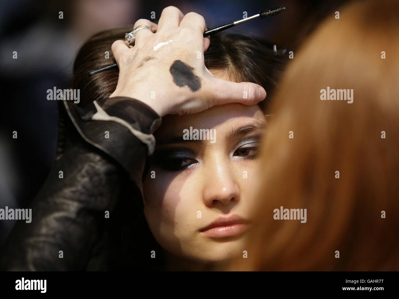 Scenes from the back stage area of the show by designer Ashley Isham ...