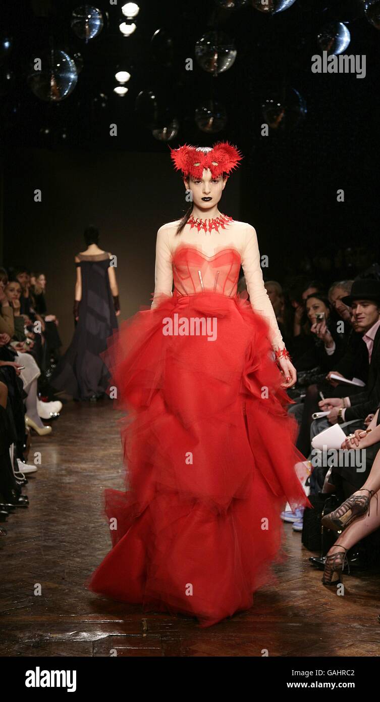 A model wears a creation by designer Giles, during London Fashion Week ...