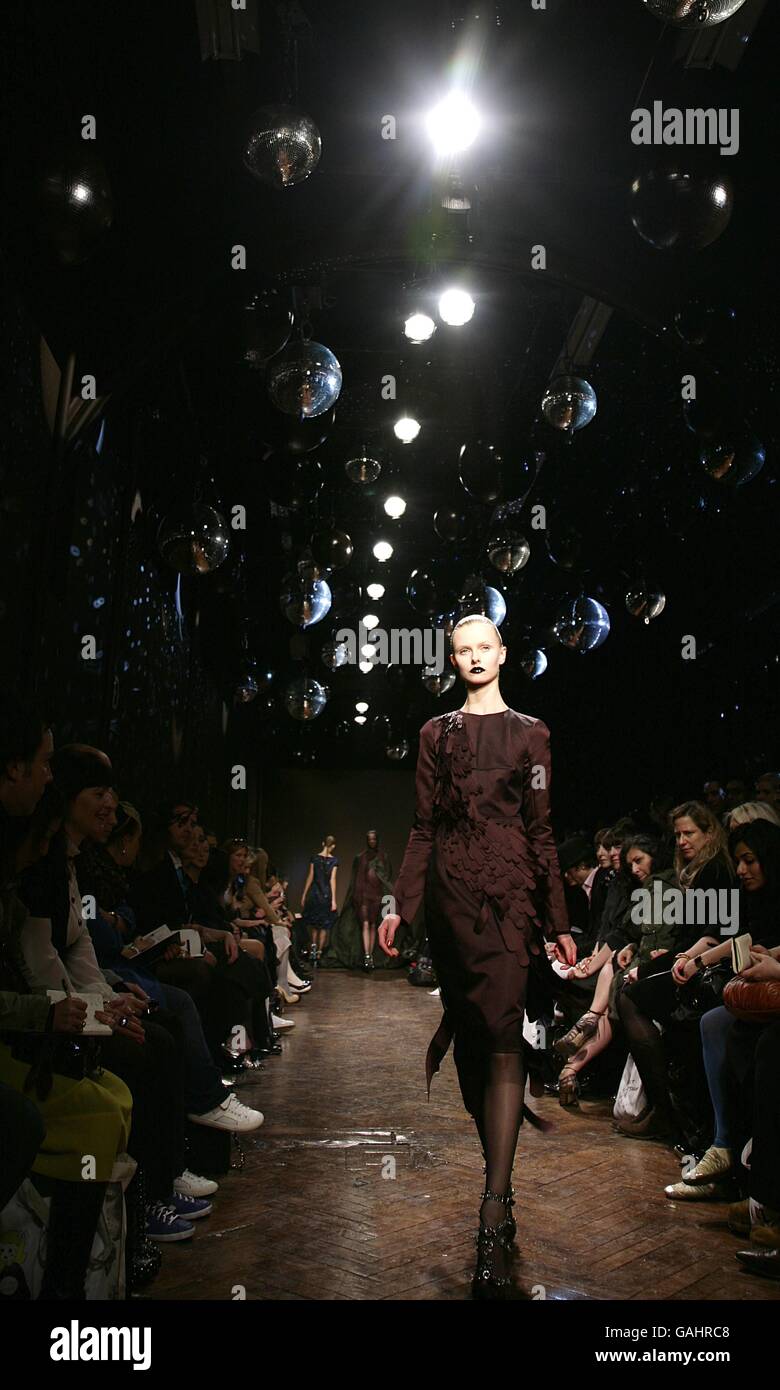 A model wears a creation by designer Giles, during London Fashion Week ...