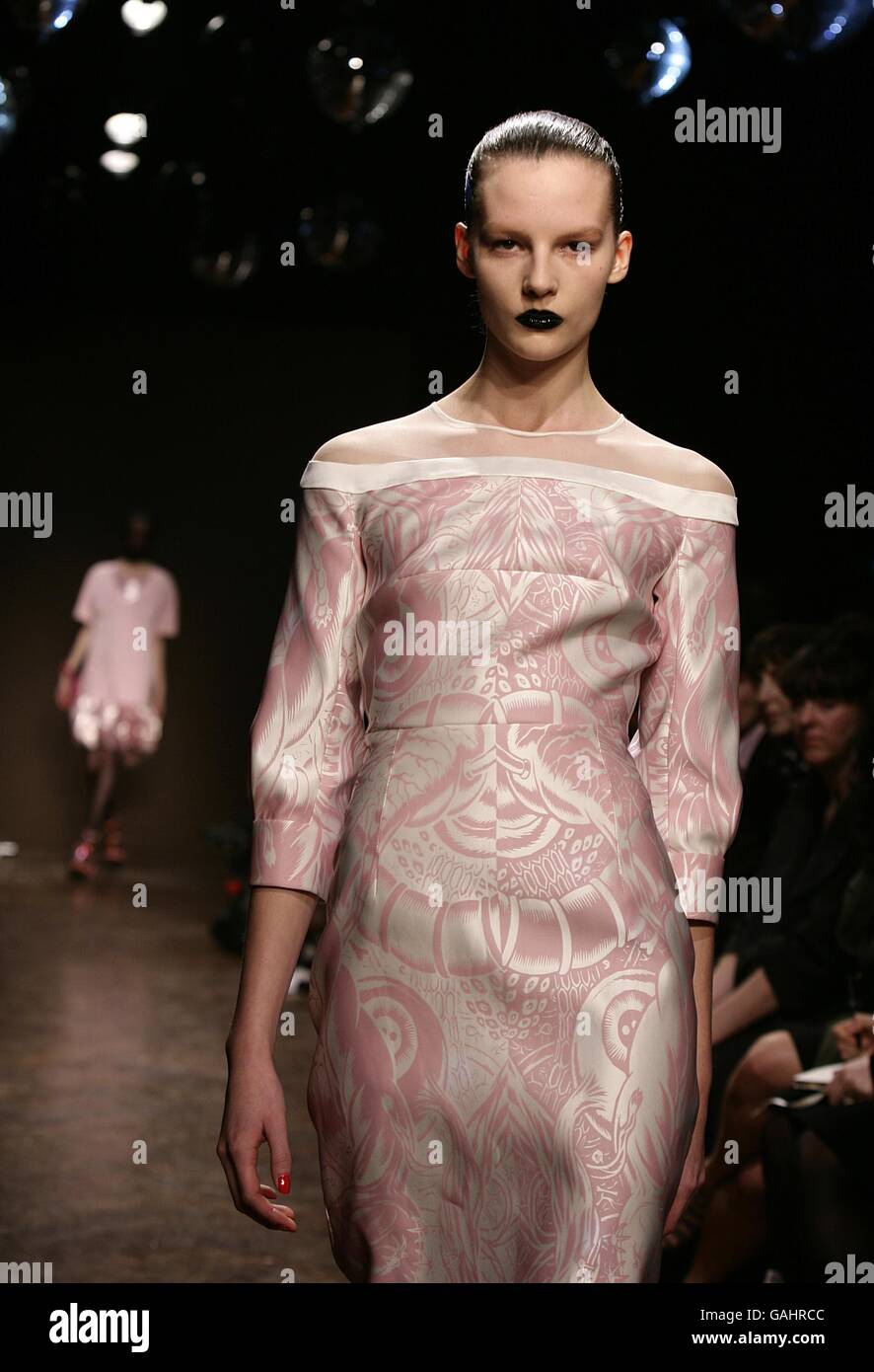 London Fashion Week - Giles Catwalk Show. A model wears a creation by ...
