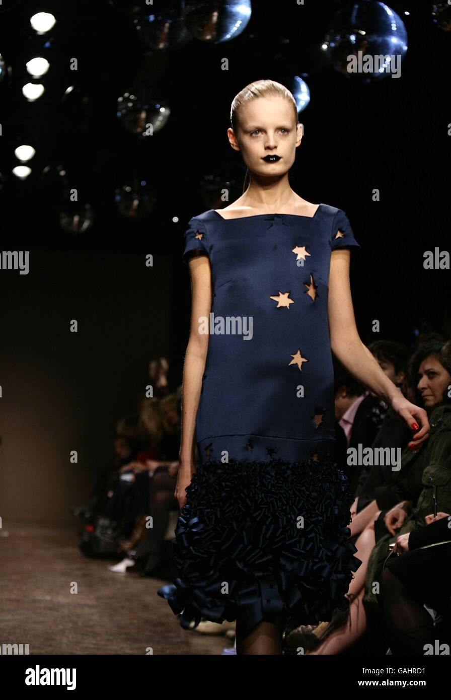 A model wears a creation by designer Giles, during London Fashion Week ...